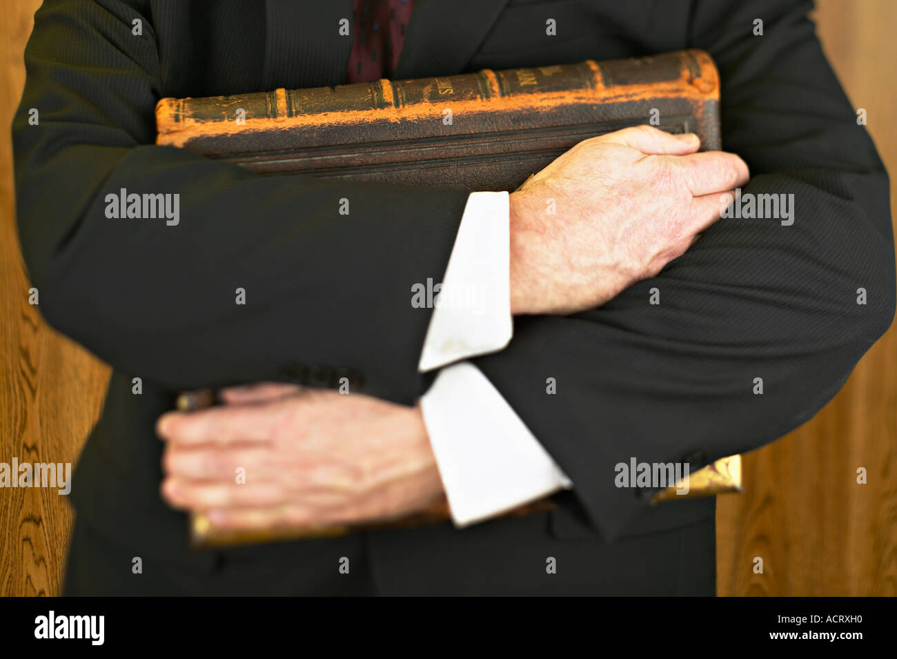 Man holding large book Stock Photo - Alamy