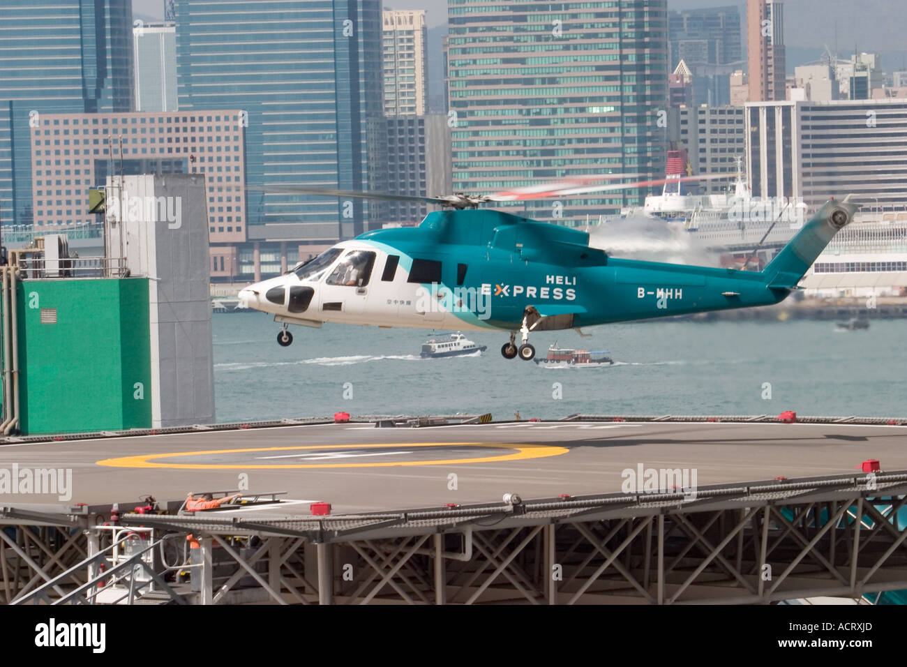HeliJet Express helicopter lands or take off at heliport shun tak ...