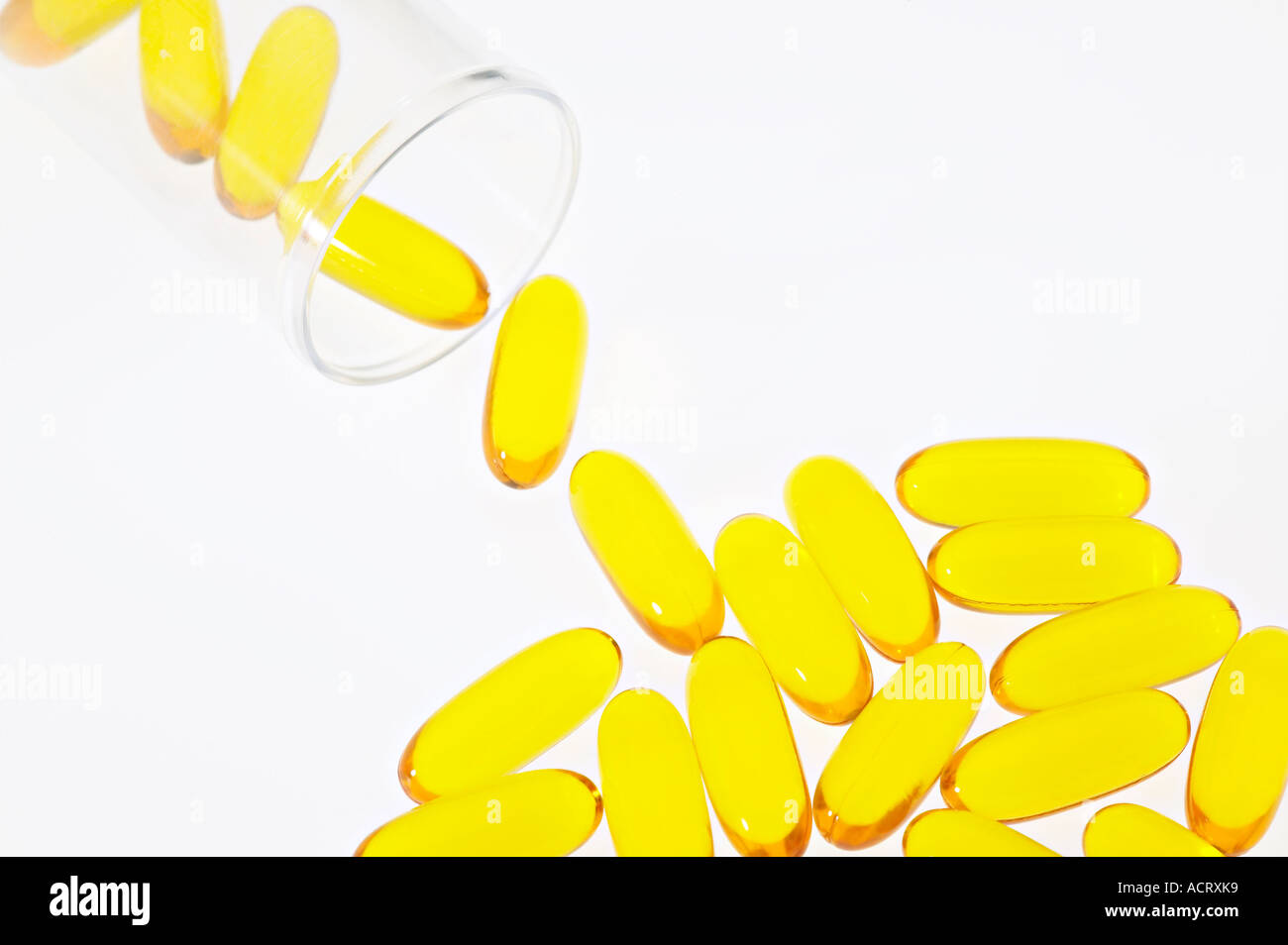 Translucent yellow pills Stock Photo - Alamy