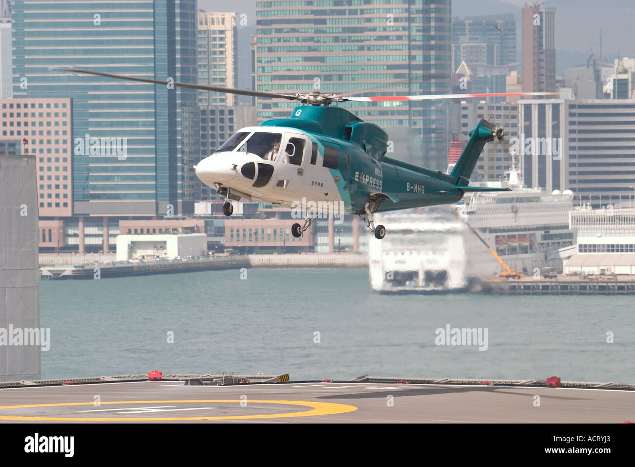 HeliJet Express helicopter lands or take off at heliport shun tak ...