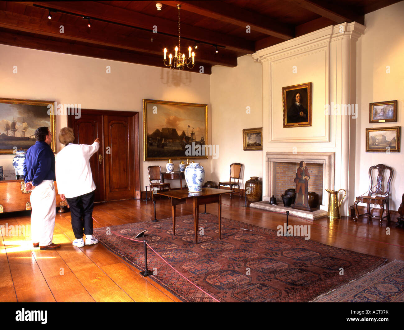 Tourists look at the original paintings in the interior of the Council ...