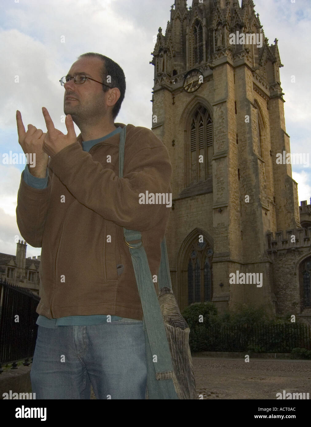 Tour guide communicating in British sign language Stock Photo - Alamy