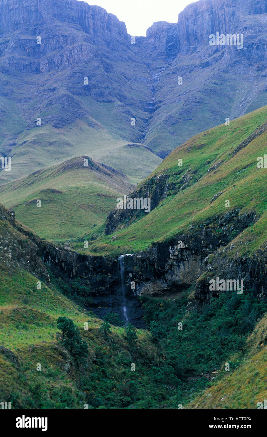 Waterfall on cave sandstone with basalt escarpment in background ...