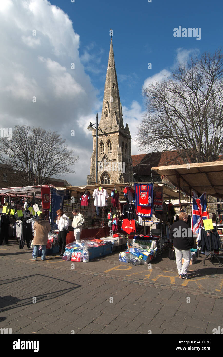 London winter street scene of people & market stalls in front of St ...
