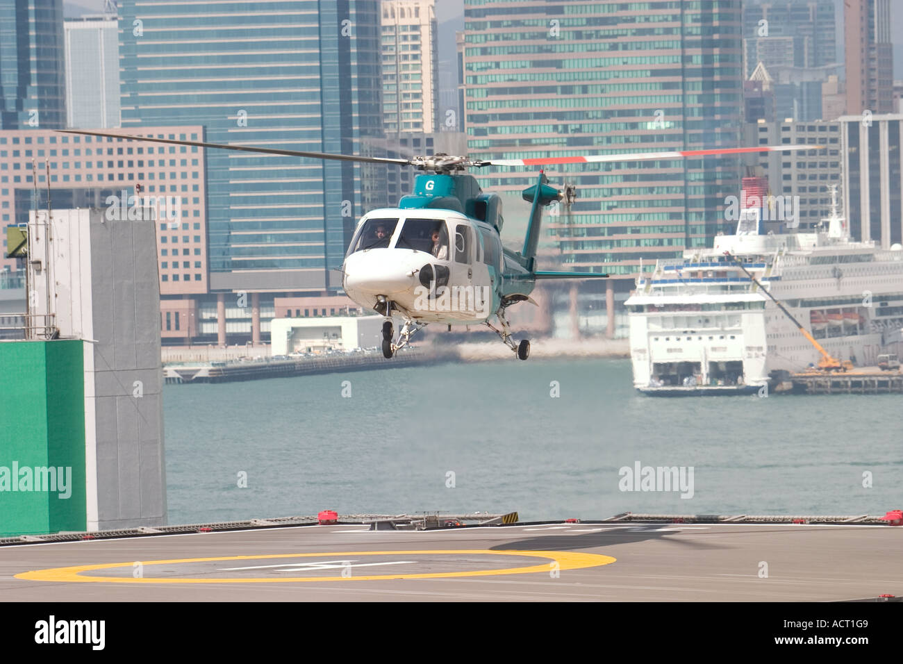 HeliJet Express helicopter lands or take off at heliport shun tak ...