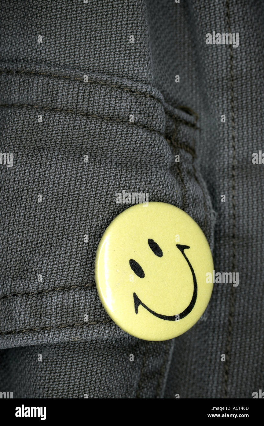 Smiley badge on a pocket Stock Photo - Alamy