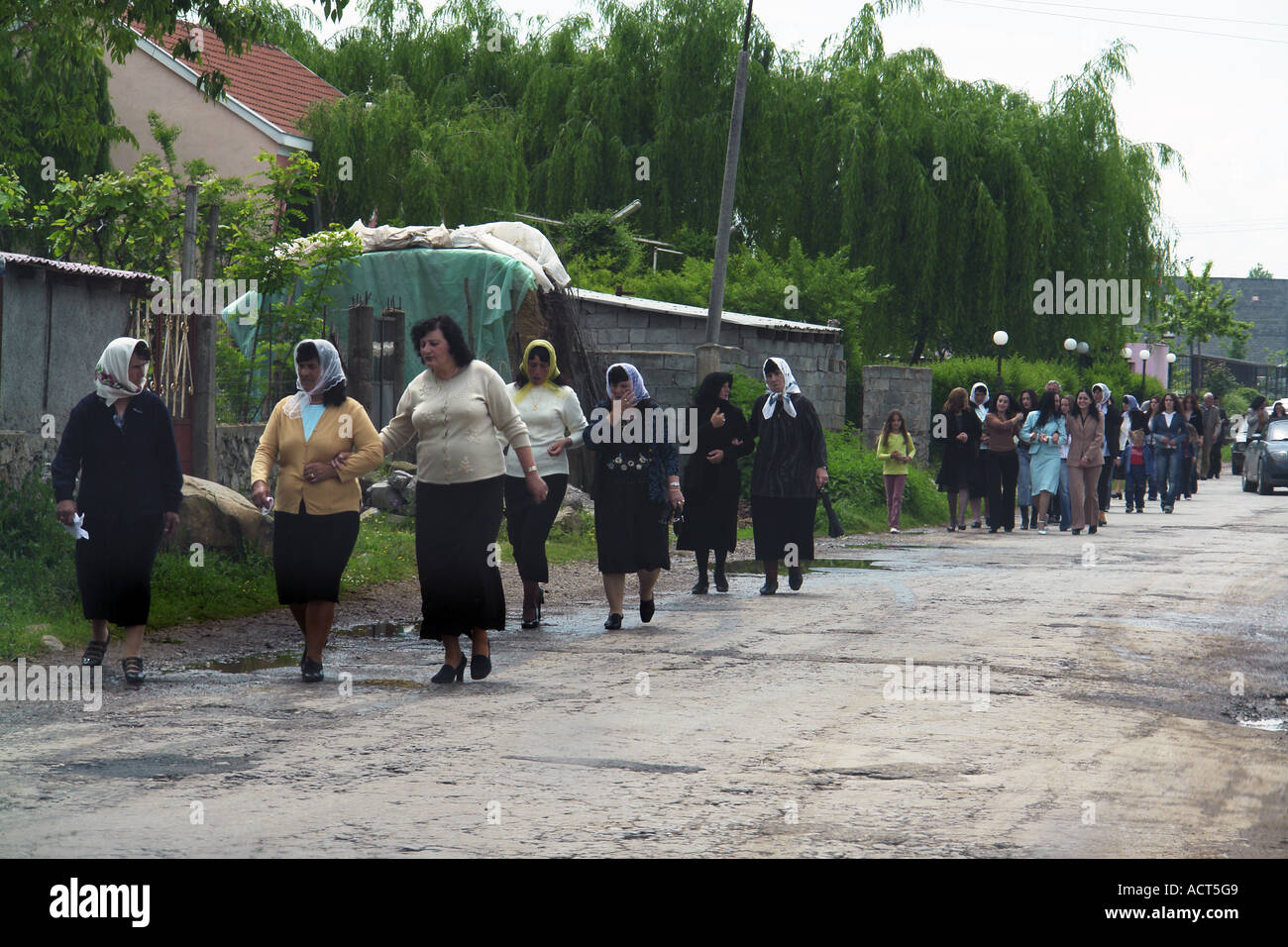 Albania women go home after sunday church Stock Photo - Alamy
