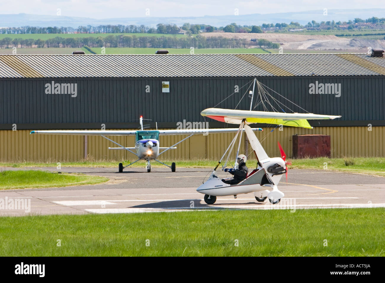 Microlight and light aircraft taxi to take off at Glenrothes local ...
