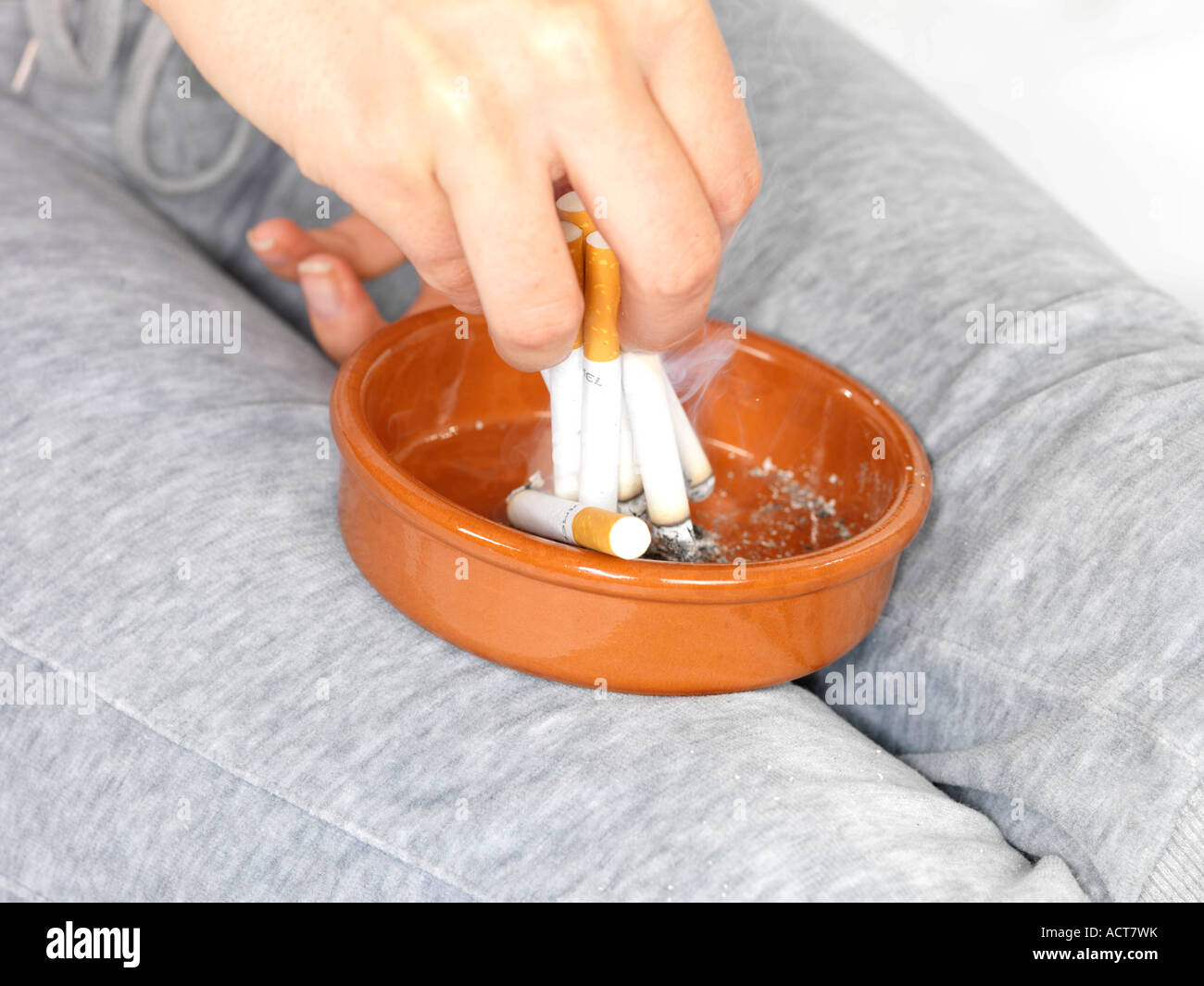 Stubbing out cigarettes hi-res stock photography and images - Alamy