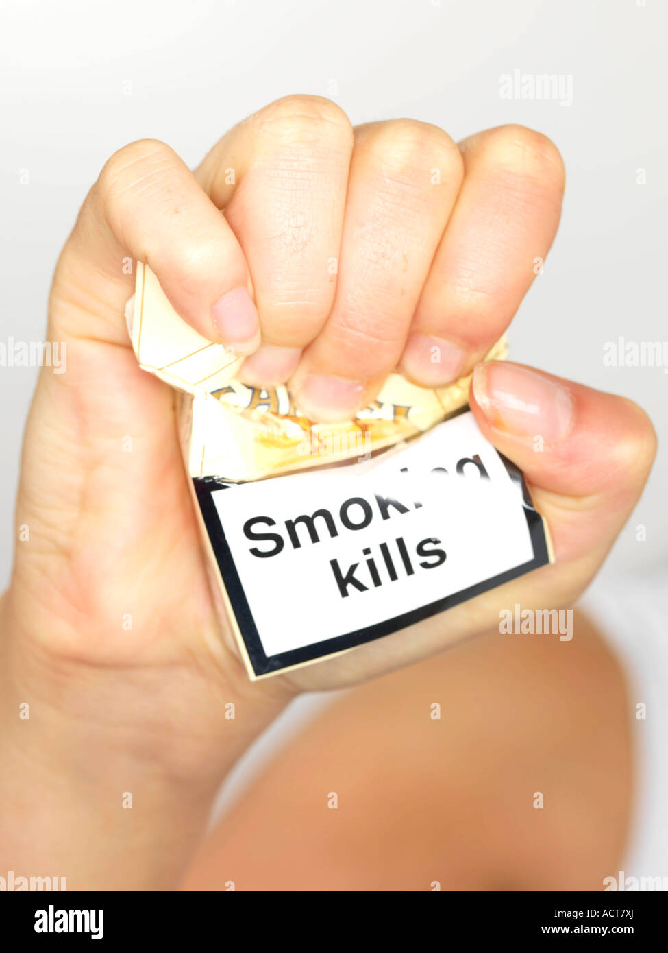 Young Woman Crushing Cigarette Box Model Released Stock Photo - Alamy