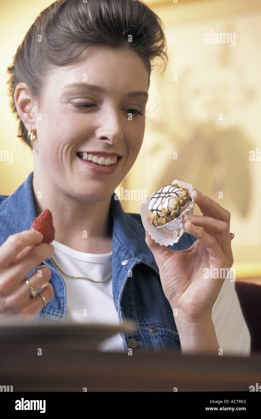 Woman cake resisting hi-res stock photography and images - Alamy
