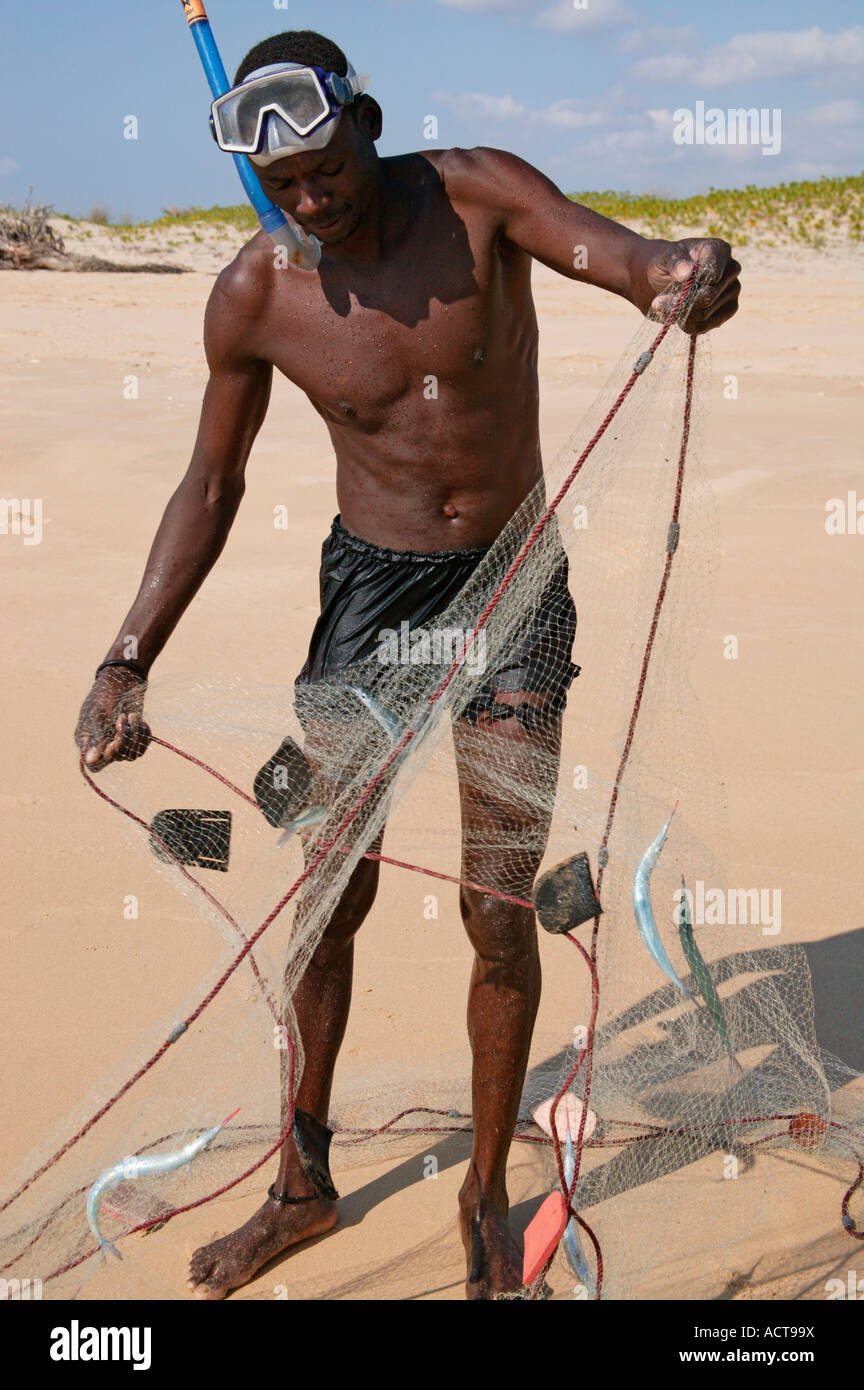 Inspecting fishing nets hi-res stock photography and images - Alamy