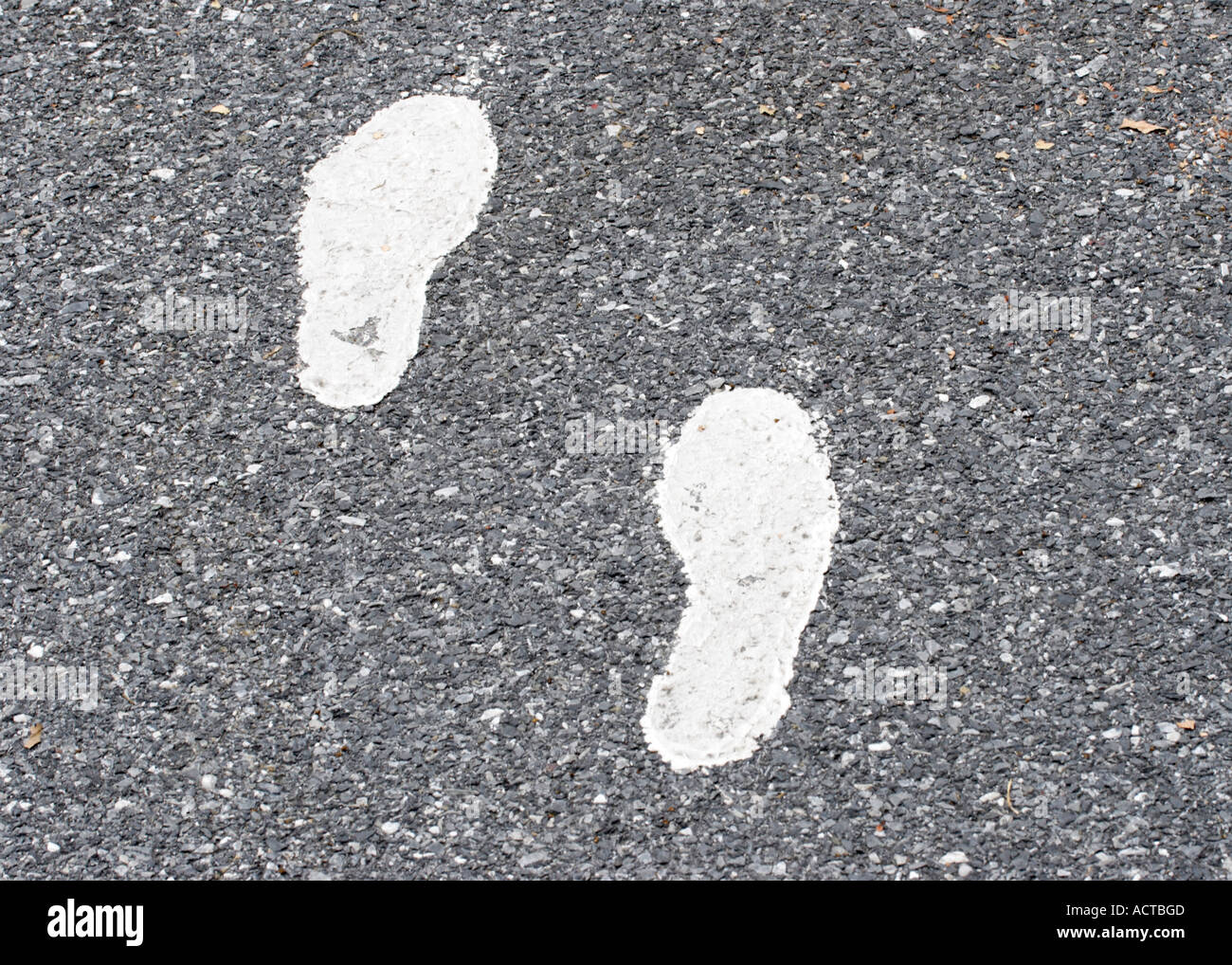 Painted footsteps on pavement Stock Photo - Alamy