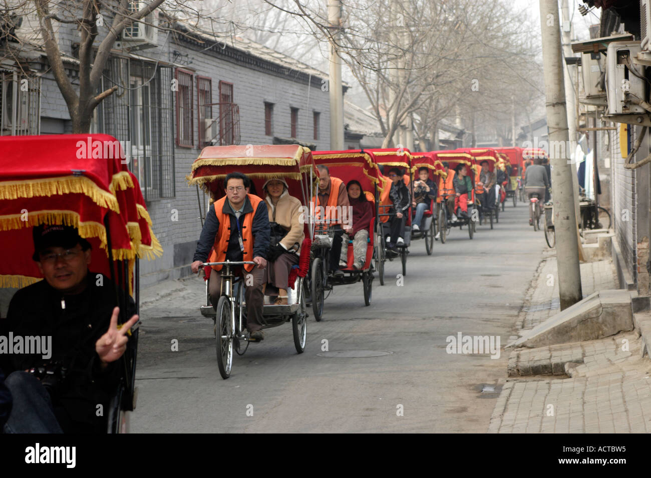 Tour Group of pedicabs in the Hutong, Beijing China Stock Photo - Alamy