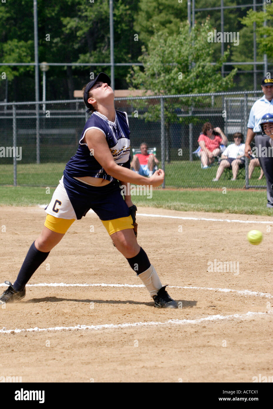 Softball pitcher throwing the ball Stock Photo - Alamy
