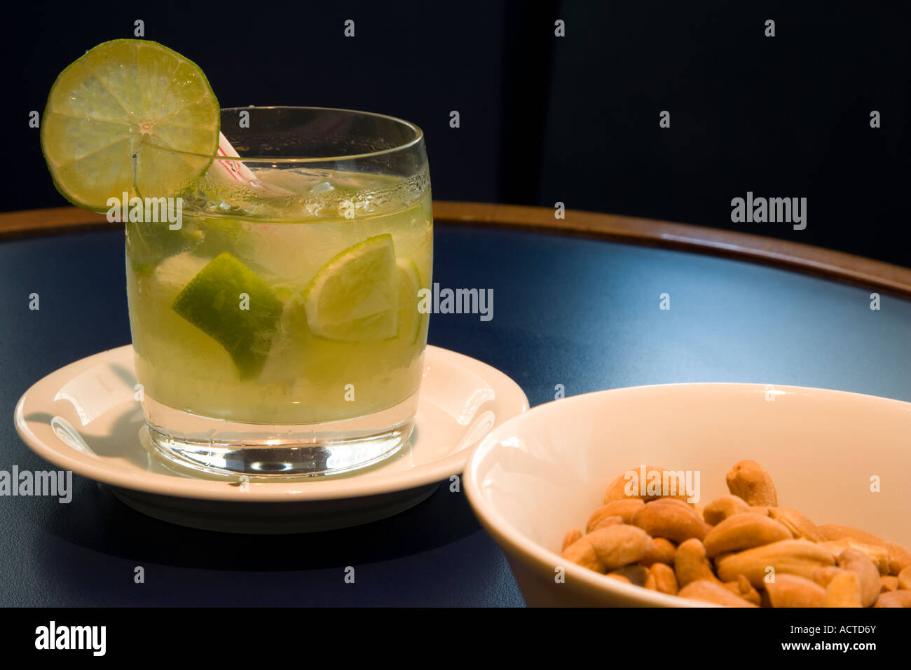 A glass of Caipirinha and bowl of Brazilian Cashew Nuts Rio de Janeiro ...
