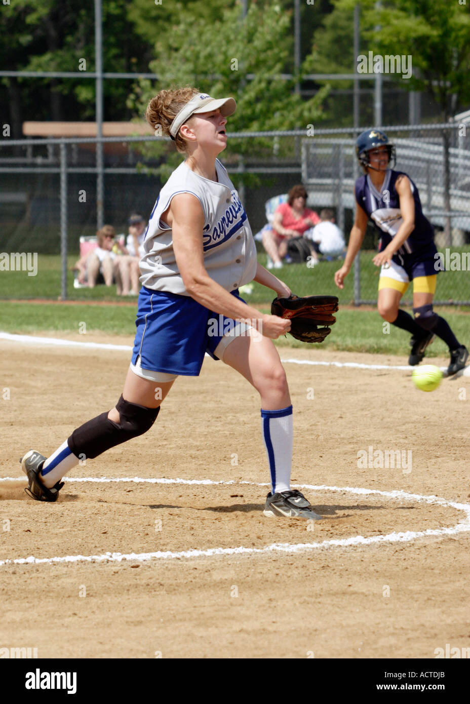Softball pitcher throwing the ball Stock Photo - Alamy