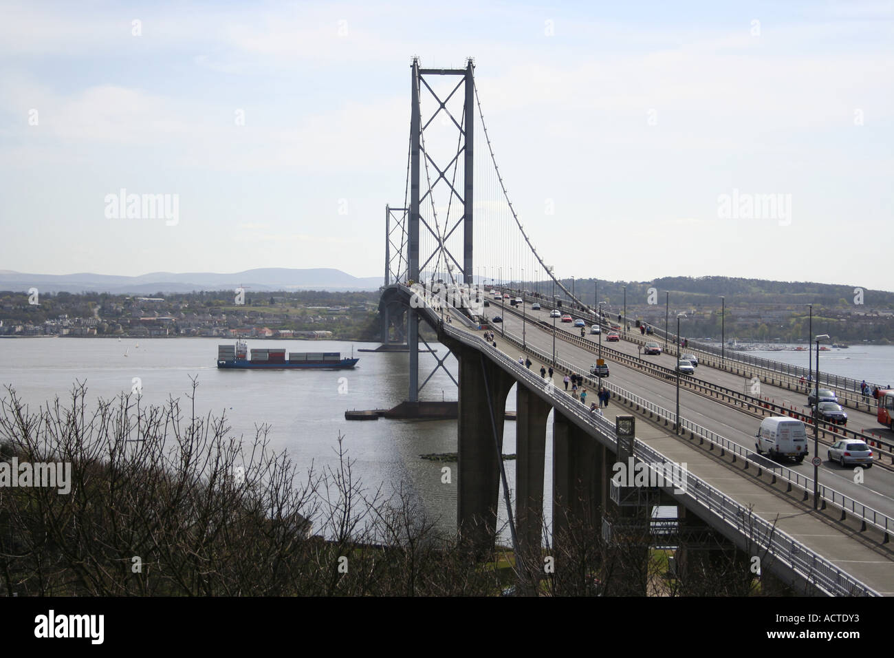 boat passing beneath the Forth Road Bridge Scotland Stock Photo - Alamy