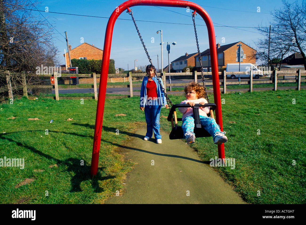 Pushed child on swing hi-res stock photography and images - Alamy