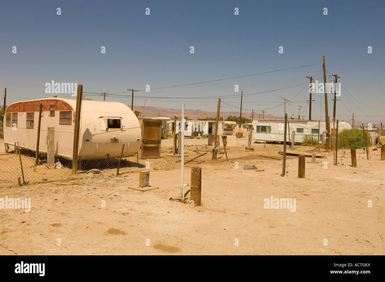 OLD TRAILERS SIT EMPTY AND DECAYING AT AN ABANDONED TRAILER PARK AT ...
