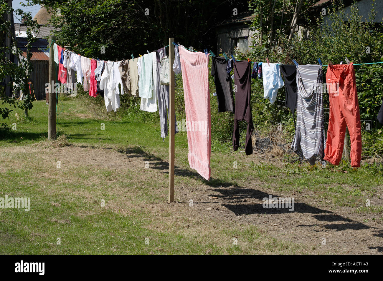 washing hanging up to dry outdoors on a line Stock Photo - Alamy