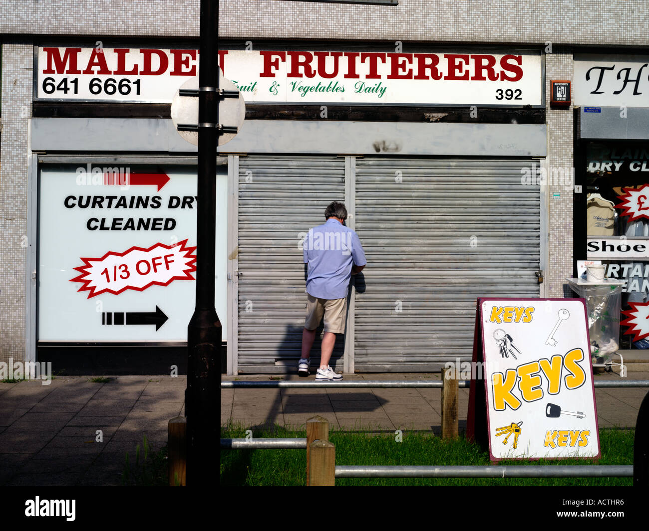 Man closing shutters hi-res stock photography and images - Alamy