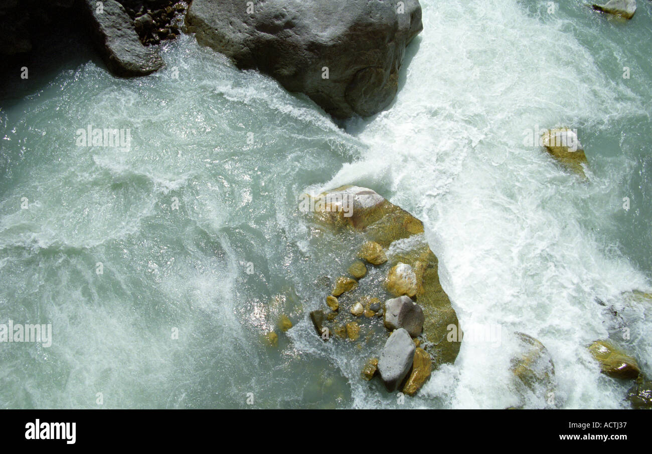 Glacial waters flowing over rocks in Dudhkoshi river in Sagarmatha ...