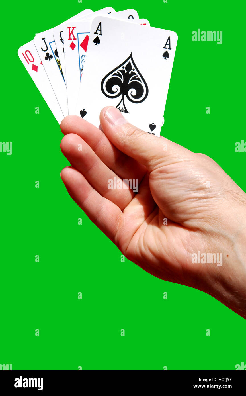 Hand holding playing cards Stock Photo - Alamy
