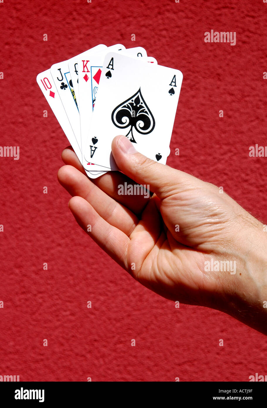 Hand holding playing cards Stock Photo - Alamy