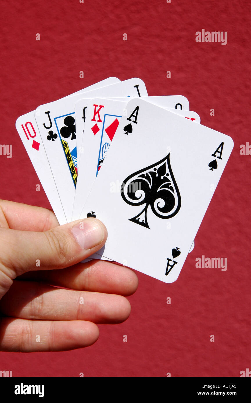 Hand holding playing cards Stock Photo - Alamy