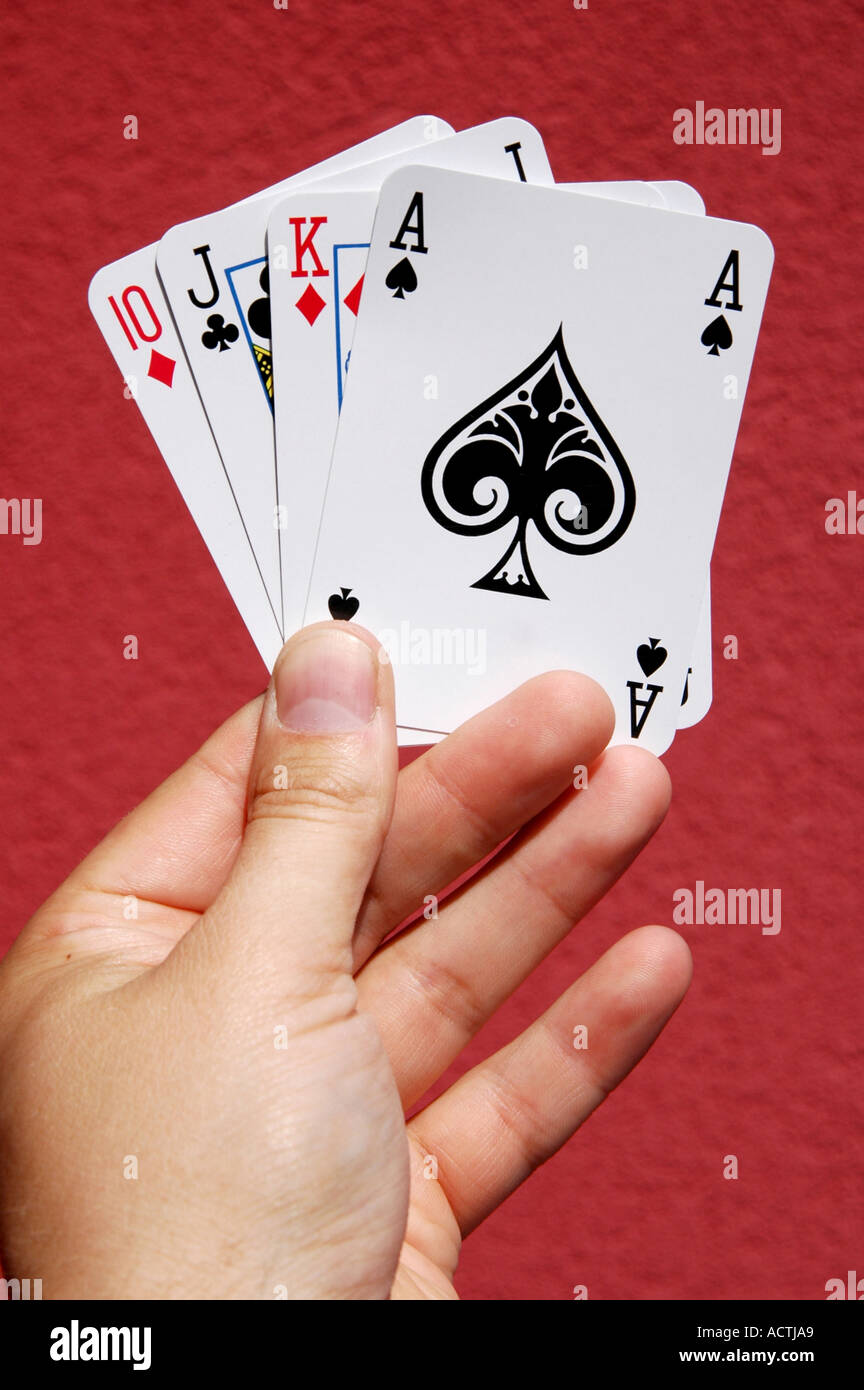 Hand holding playing cards Stock Photo - Alamy
