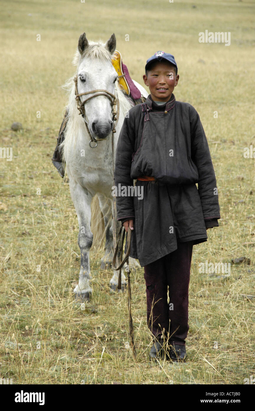 Portrait nomads shepherd boy dressed in traditional coat is standing in ...