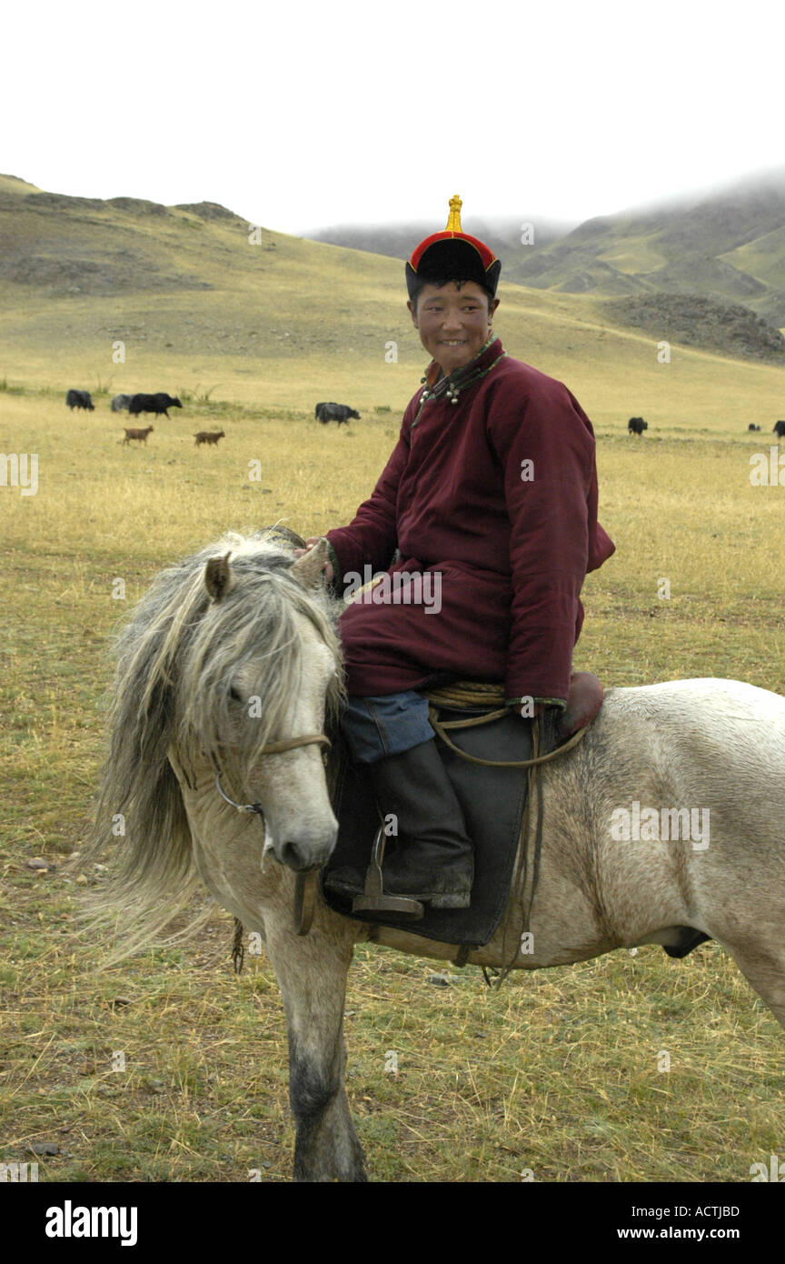 Portrait nomads shepherd boy dressed in traditional coat and hat is ...
