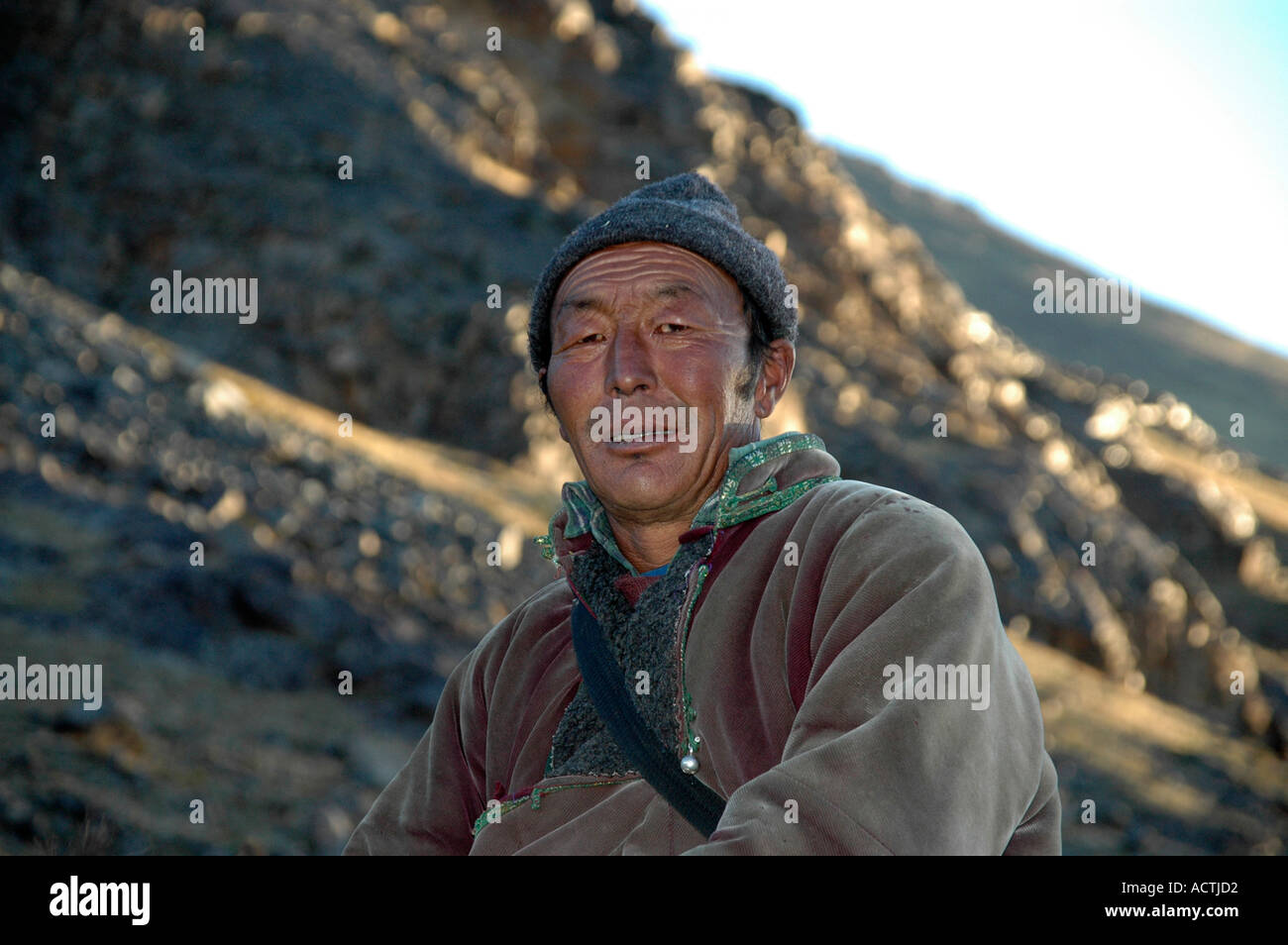 Nomads man covered in a traditonal coat Kharkhiraa Mongolian Altai near ...
