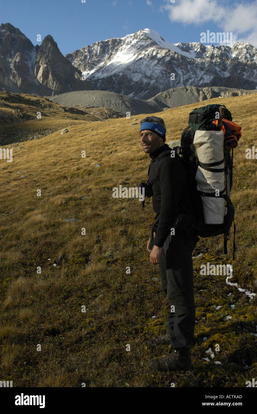 MR Mountaineer carrying his backpack in the steppe Turgen Uul ...