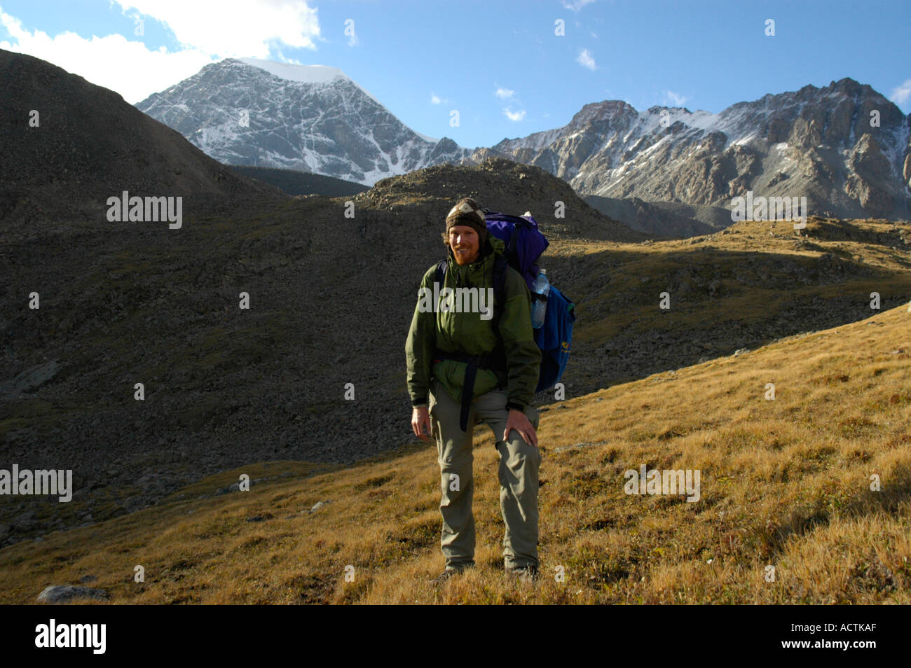 MR Mountaineer carrying his backpack in the steppe Turgen Uul ...