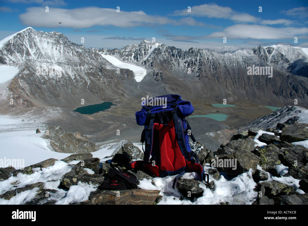 Backpack on a peak with a view into the mountain scenery of Turgen Uul ...