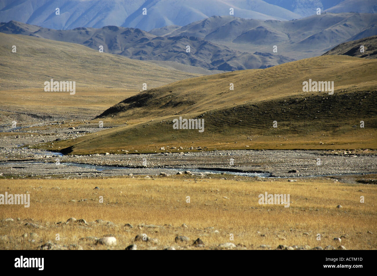 River and hills in wide open steppe Kharkhiraa Mongolian Altai near ...