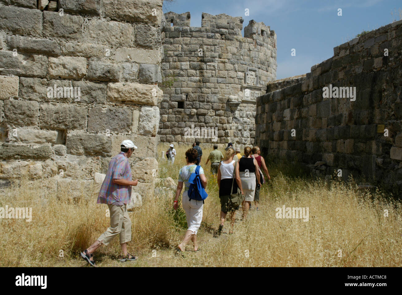 MR Ancient Greece active seniors woman is hiking with a group through ...