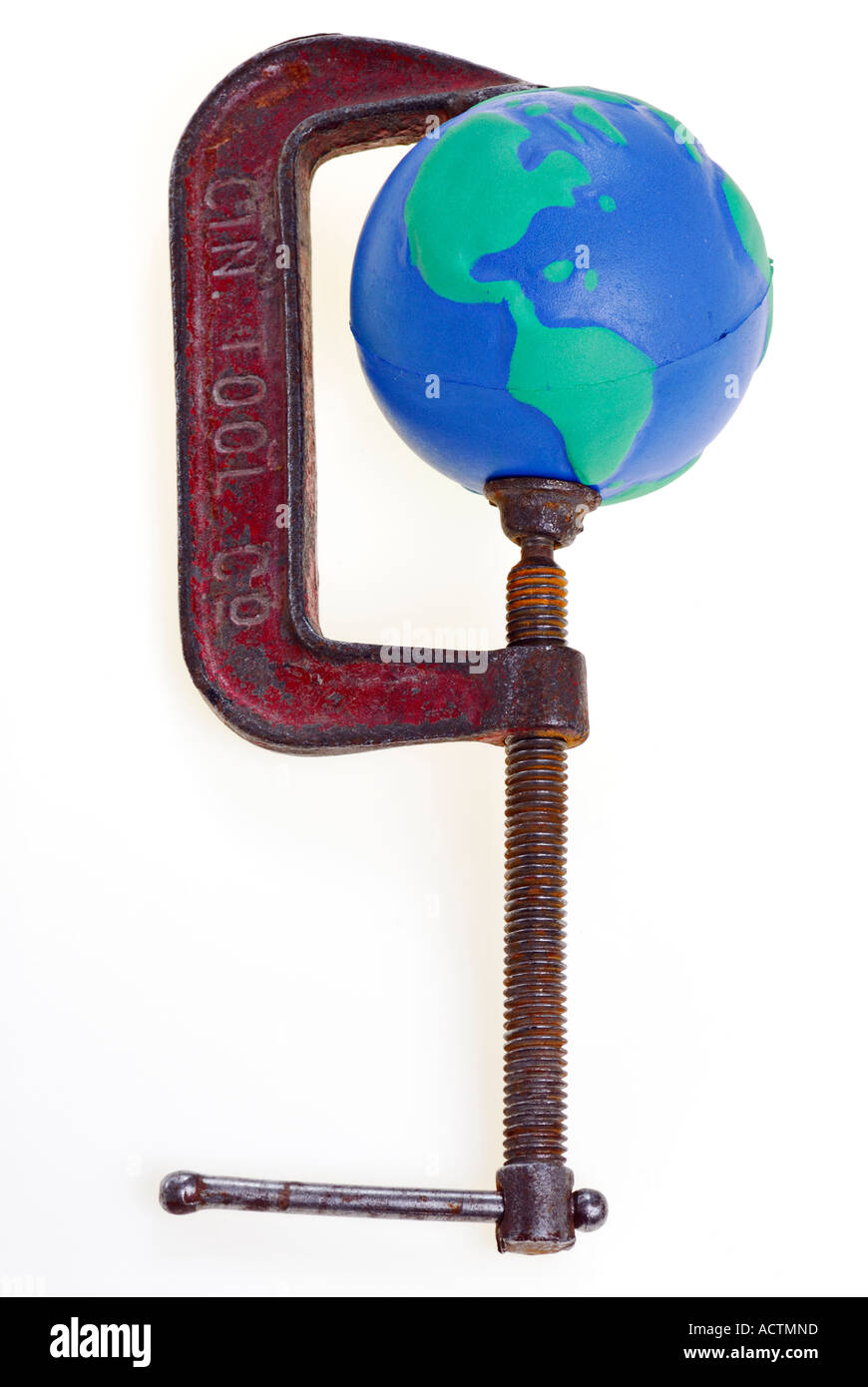 Rubber ball world being squeezed by a metal C clamp Stock Photo - Alamy