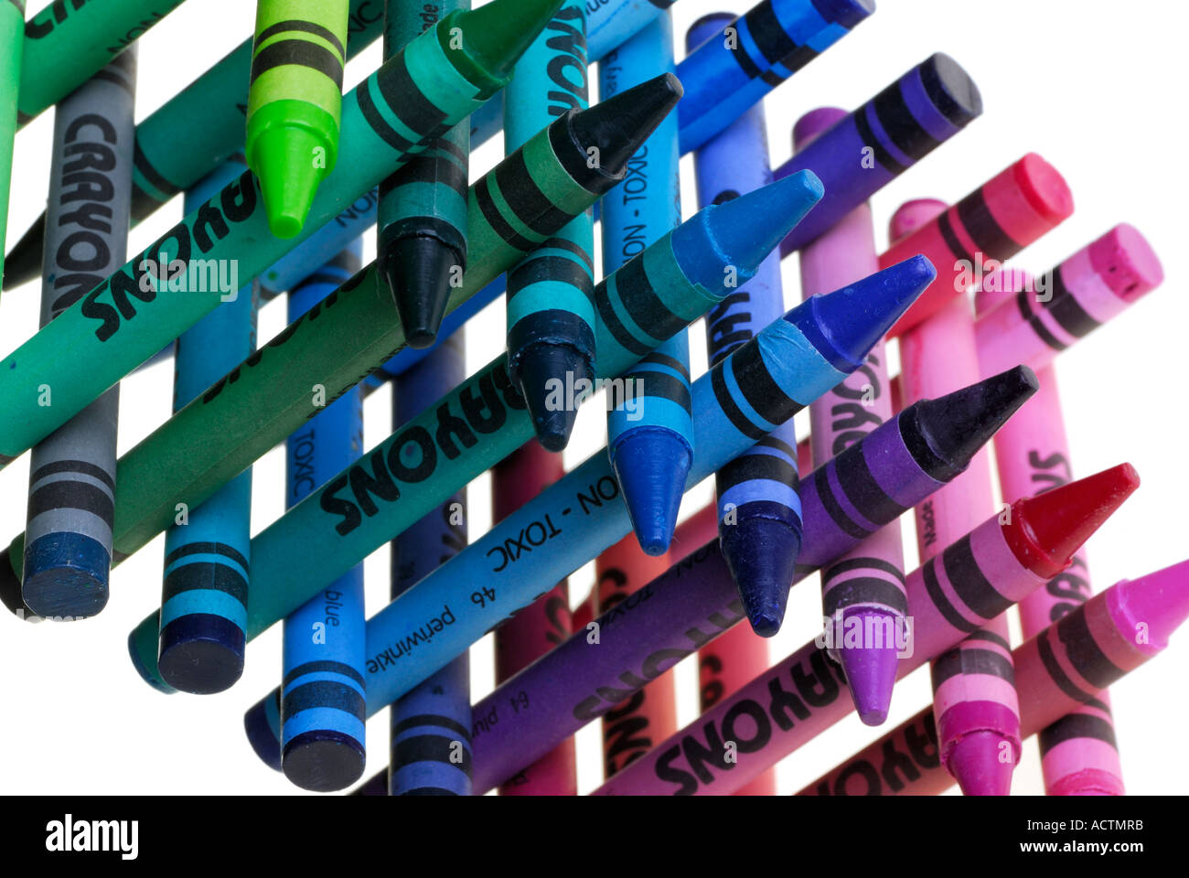 Angled Multi colored crayons stacked up in a cross hatch on white ...