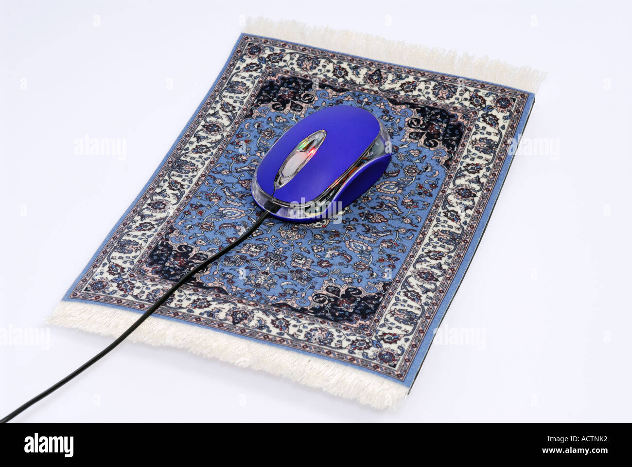 Computer mouse on a flying oriental rug Stock Photo - Alamy