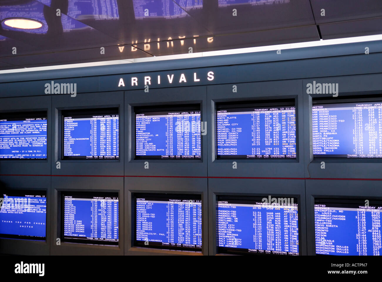 Arrival flight TV screens at large international airport Stock Photo ...