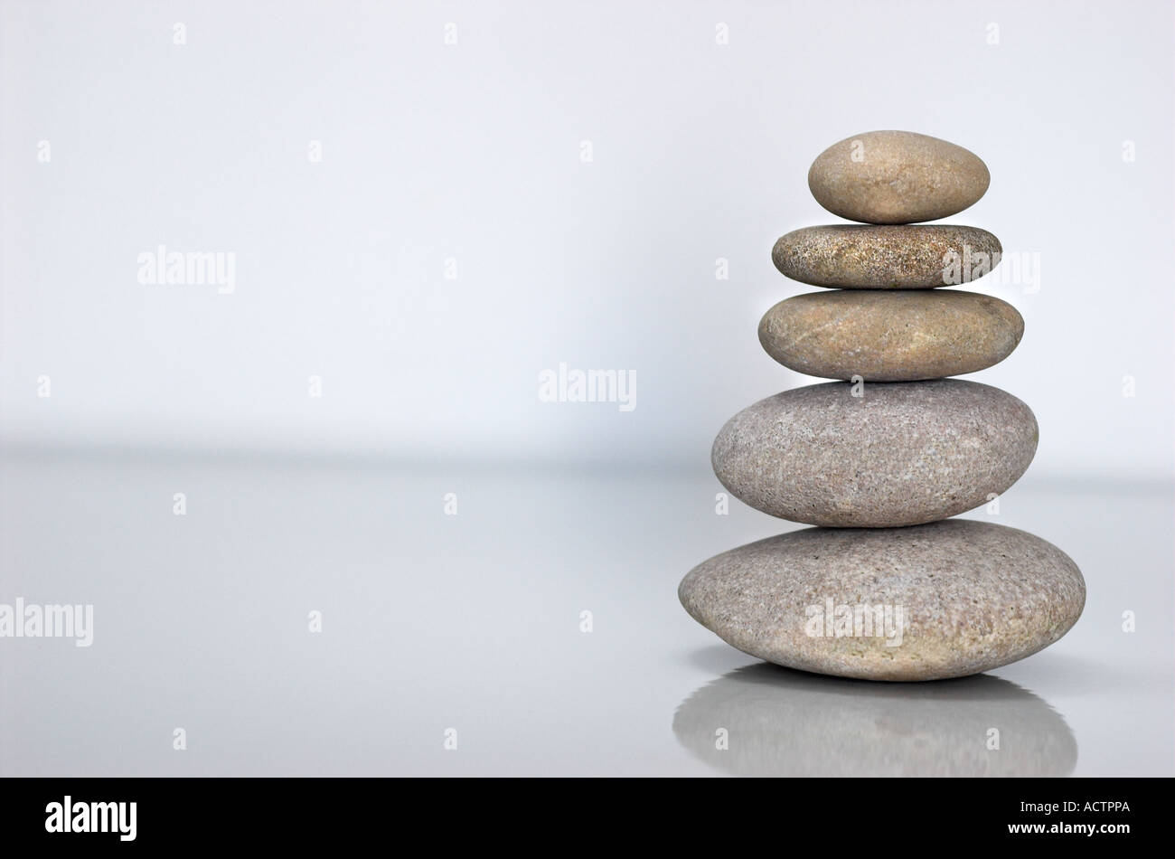Group of various sized pebbles balanced on top of one another Stock ...