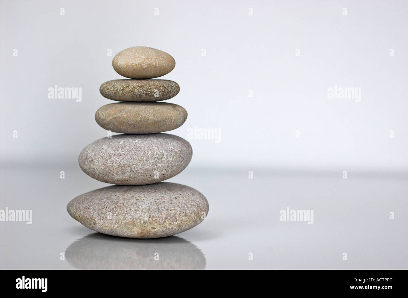 Group of various sized pebbles balanced on top of one another Stock ...