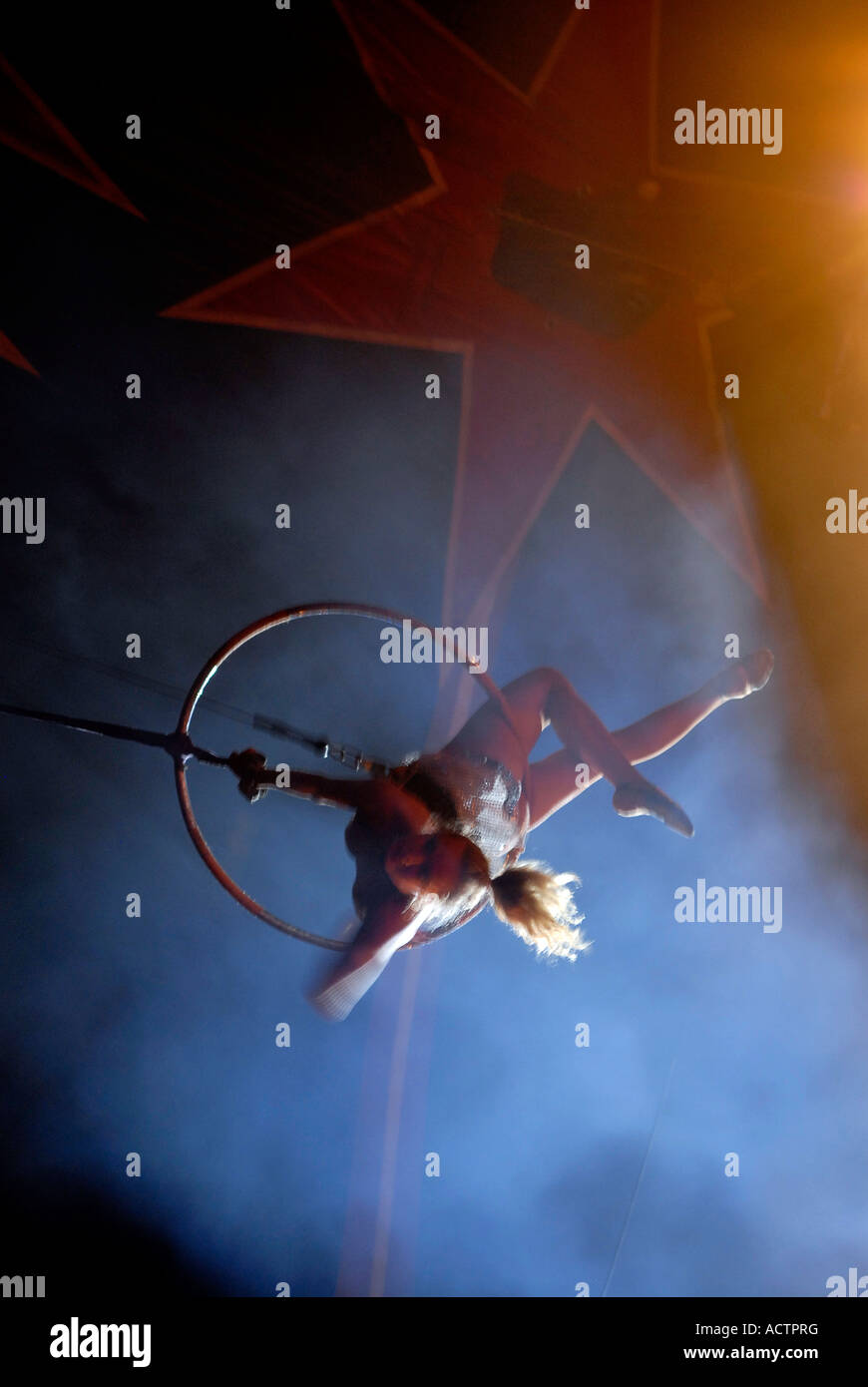 Circus acrobat performer using Aerial Hoop also known as "Cerceau" or ...