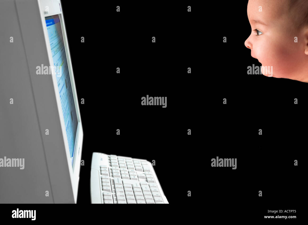 Baby Looking at Computer Monitor Stock Photo - Alamy