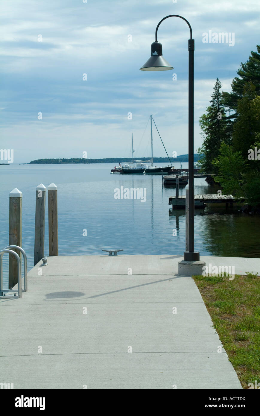 PORTRAIT OF A STREET LIGHT ON THE EDGE OF SIDE WALK AROUND THE LAKE ...