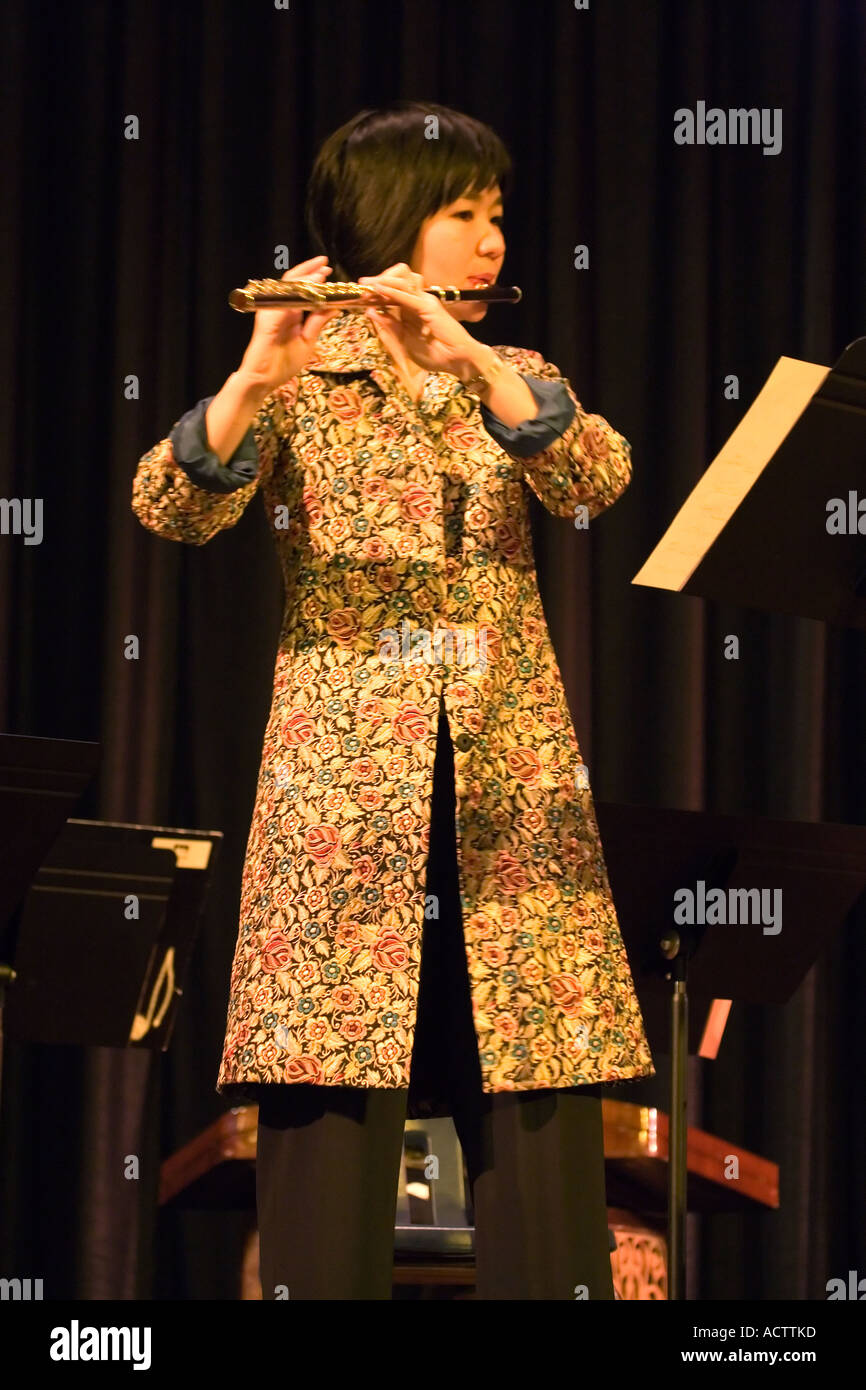 Chinese composer and flutist Su Lian Tan playing her composition at a ...