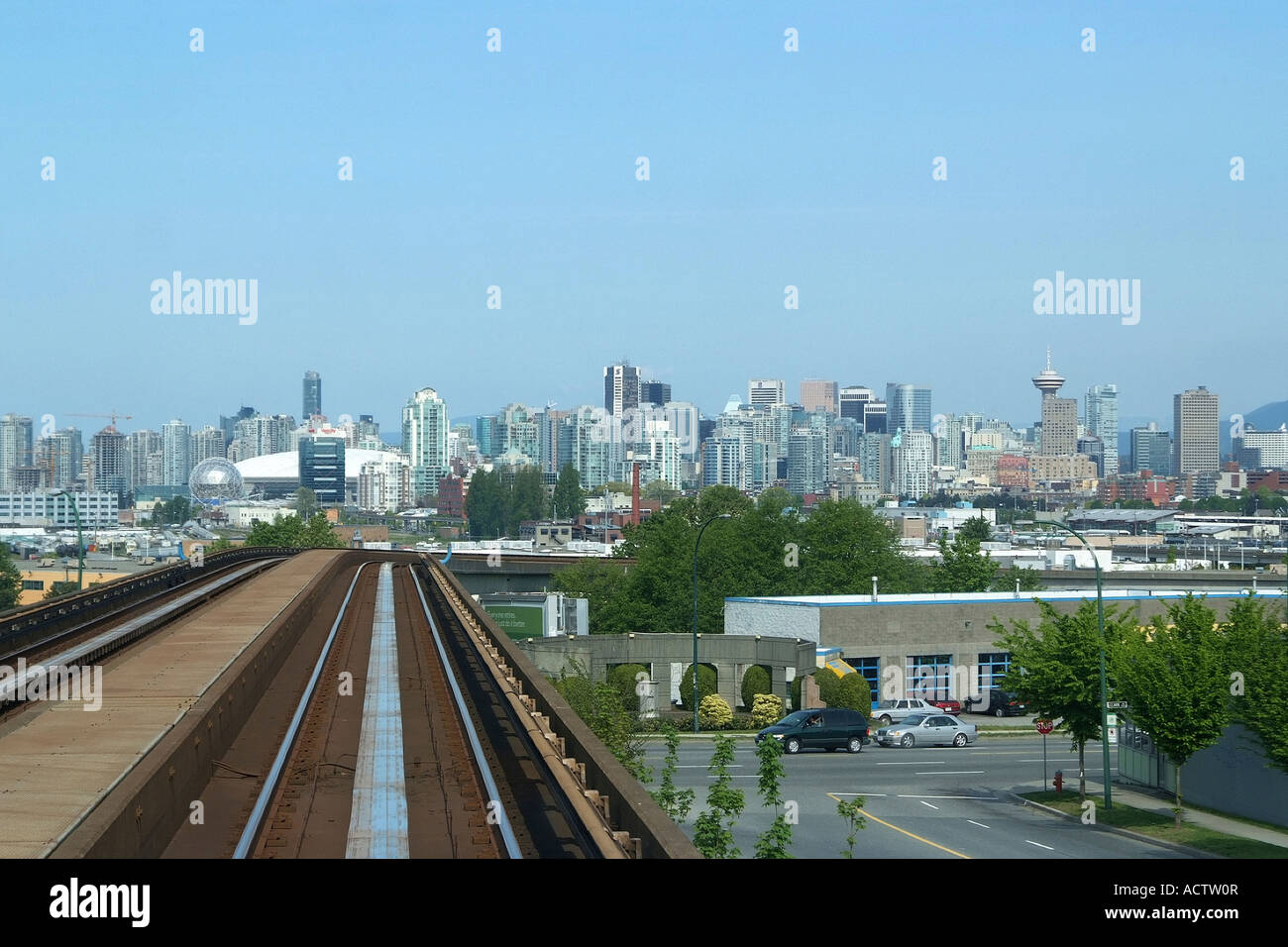 A VIEW OF RAIL ROAD TRACKS LEADING TO DOWNTOWN VANCOUVER FROM INSIDE AN ...